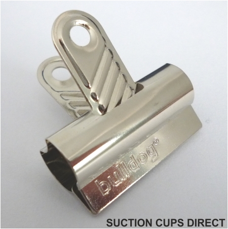 Suction cups with bulldog clip for windows or glass doors.